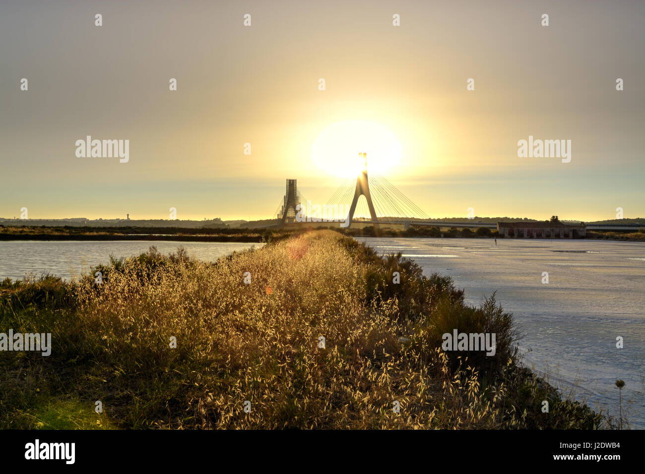 Sunset over salt fields in Portimao, Portugal Stock Photo - Alamy