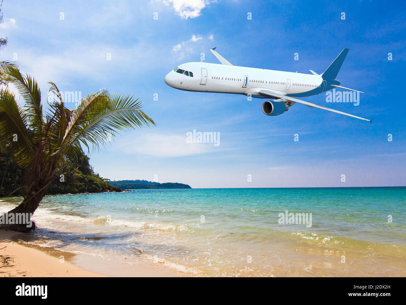 Jet plane over the tropical sea Stock Photo - Alamy