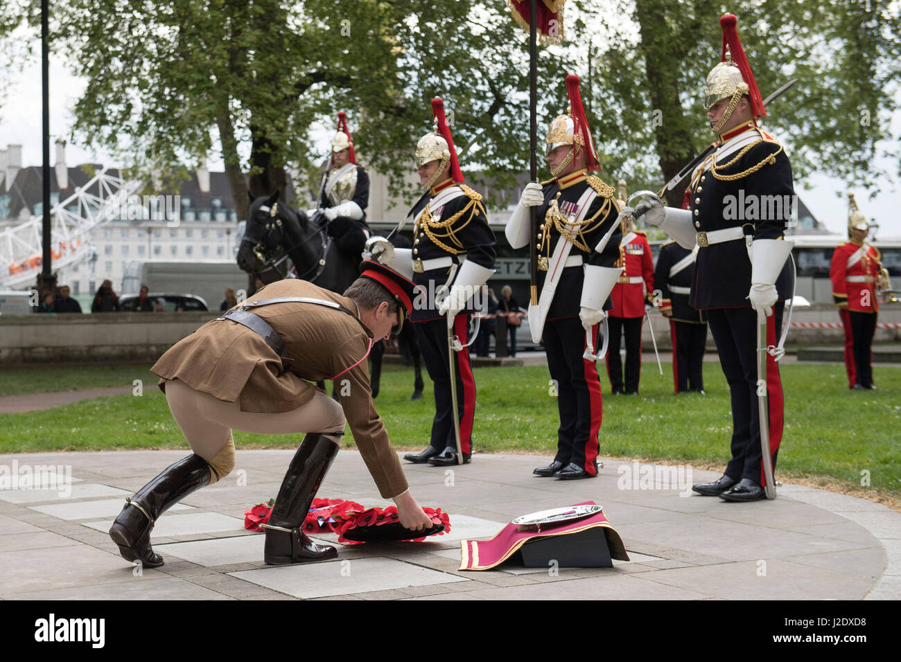 Colonel Crispin Lockhart MBC lays a poppy wreath at the memorial paving ...
