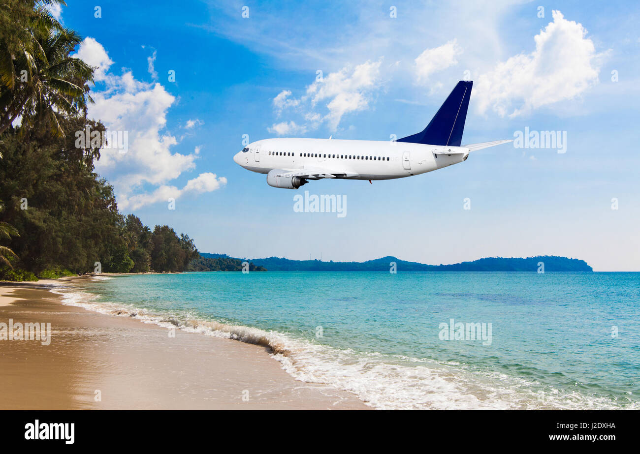 Jet plane over the tropical sea Stock Photo - Alamy