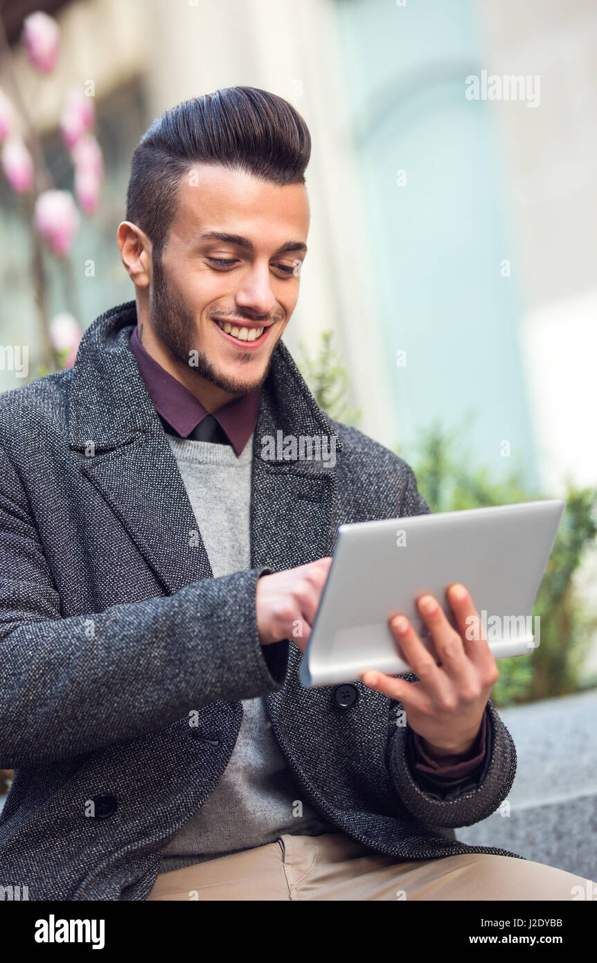Young man interacting digital hi-res stock photography and images - Alamy