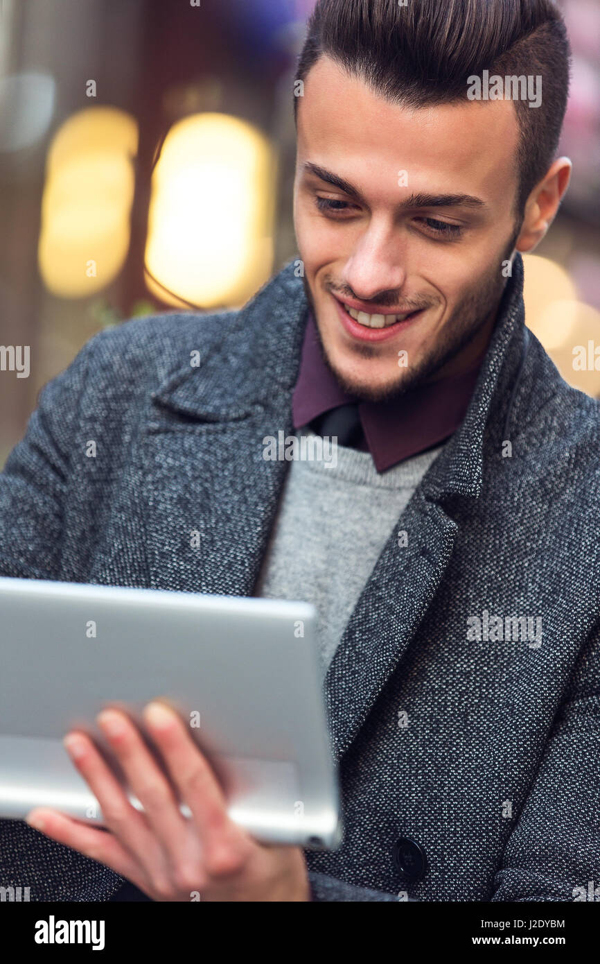 Man smiling tablet outside hi-res stock photography and images - Alamy
