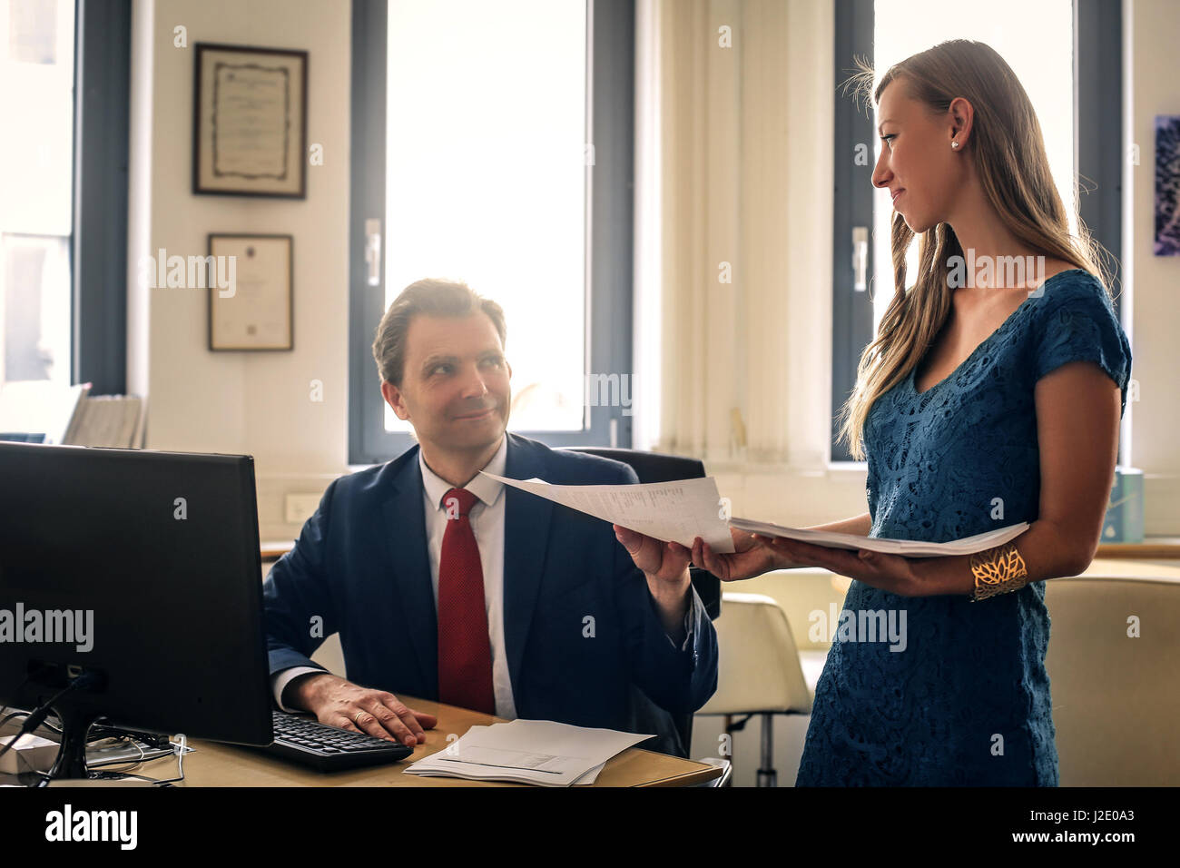 Businessman and his assistant in office Stock Photo - Alamy