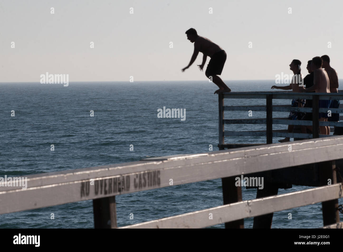 Kid jumping diving board hi-res stock photography and images - Alamy
