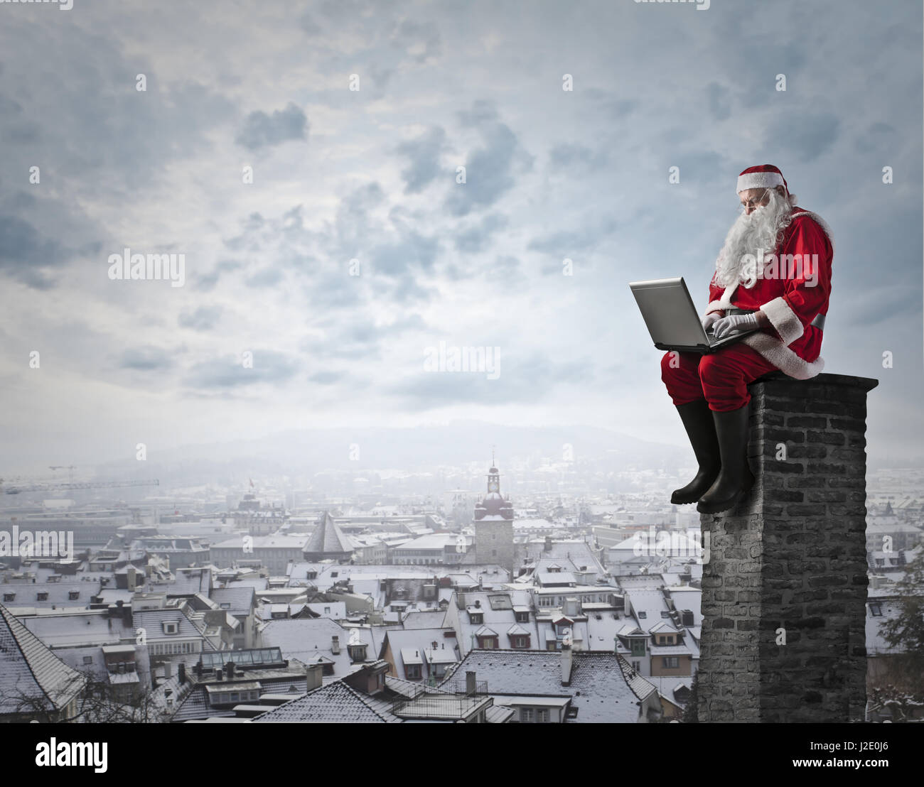 Santa Claus sitting on chimney Stock Photo - Alamy