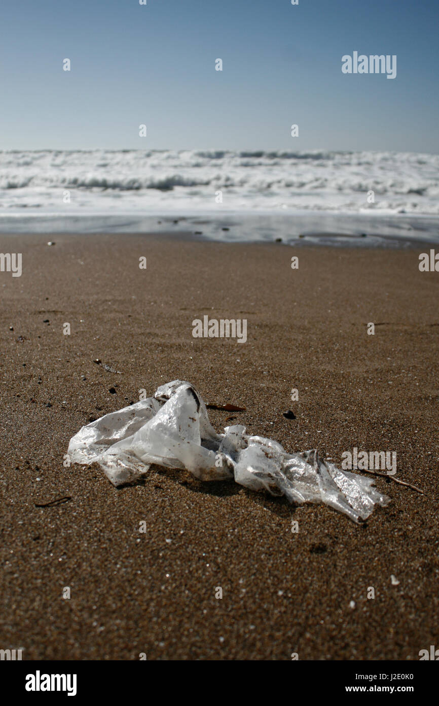 Trash on the beach Stock Photo - Alamy