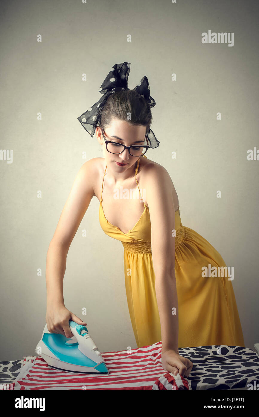 Woman ironing inside Stock Photo - Alamy