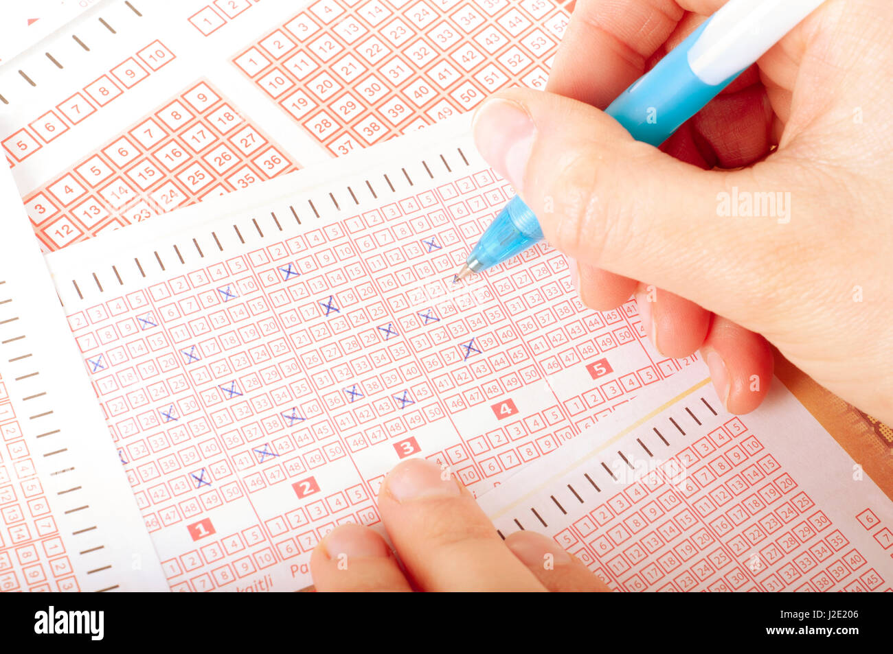Person's Hand Marking Number On Lottery Ticket With Pen Stock Photo - Alamy