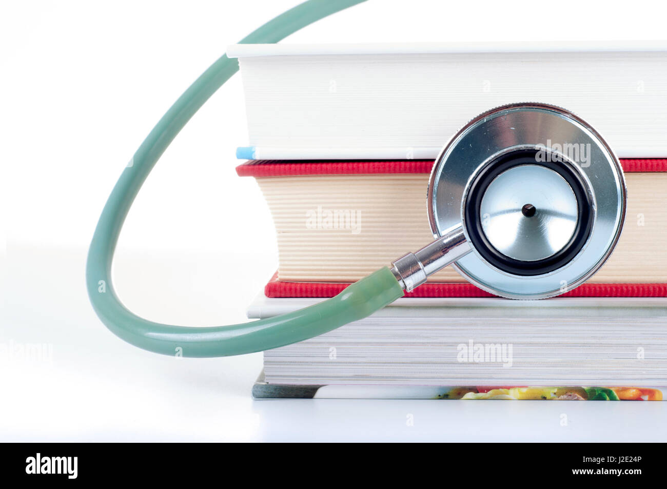 Stethoscope with textbook hi-res stock photography and images - Alamy