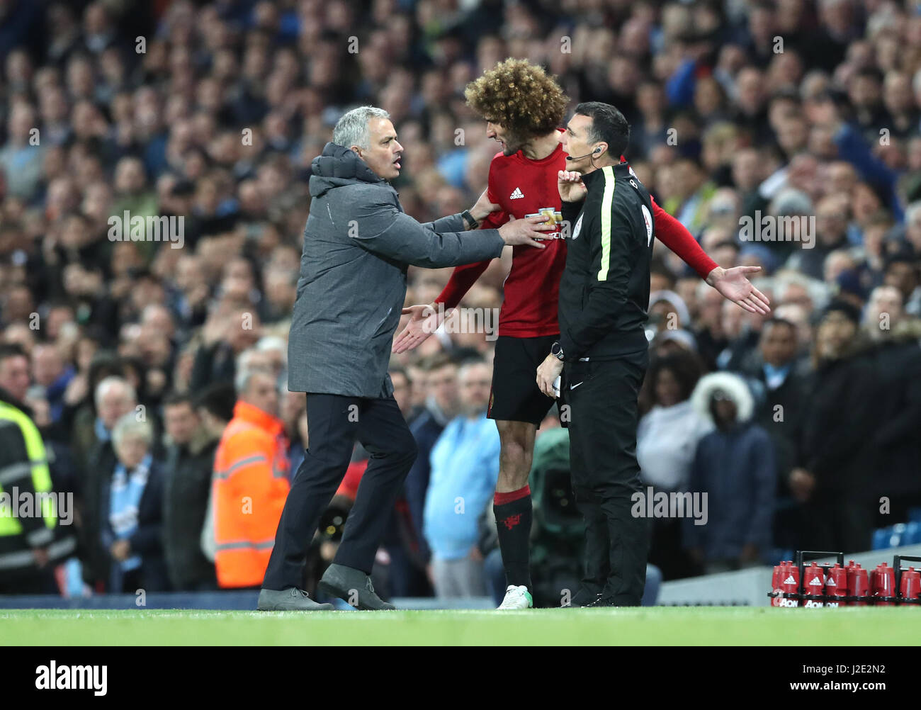 Manchester United manager Jose Mourinho tries to calm down Marouane ...