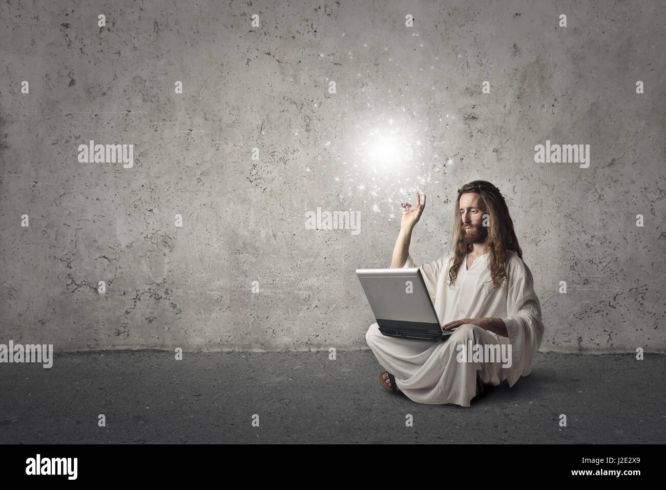 Jesus with laptop making magic Stock Photo - Alamy