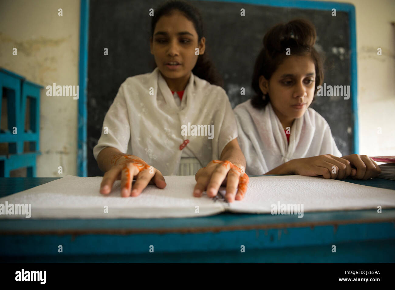 Visually impaired girl students learn in classroom with the help of ...