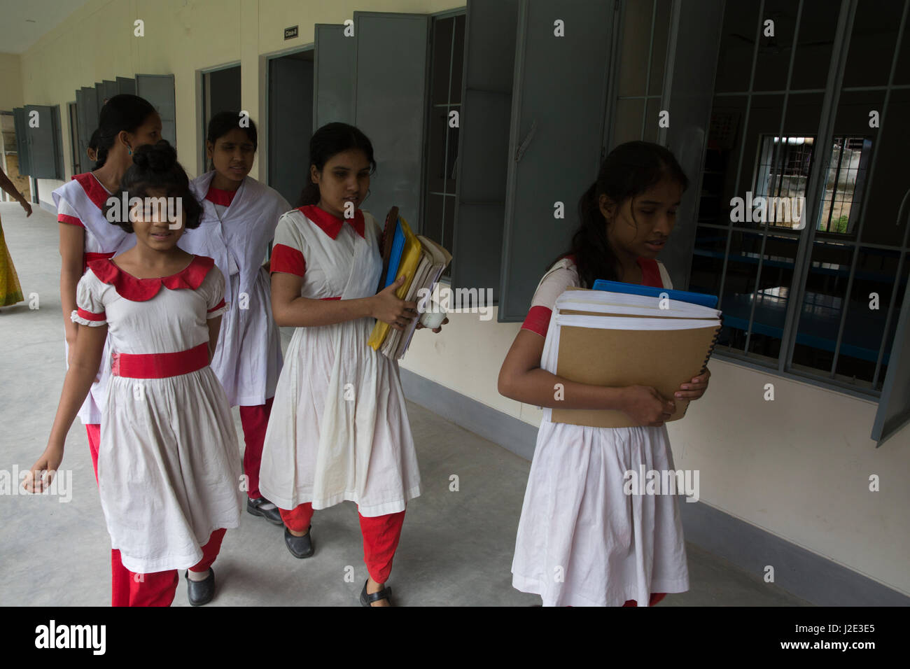 Visually impaired girl students walk through the school veranda at the ...