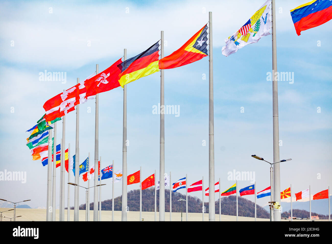 Flags of countries. different countries on the flagpole Stock Photo - Alamy
