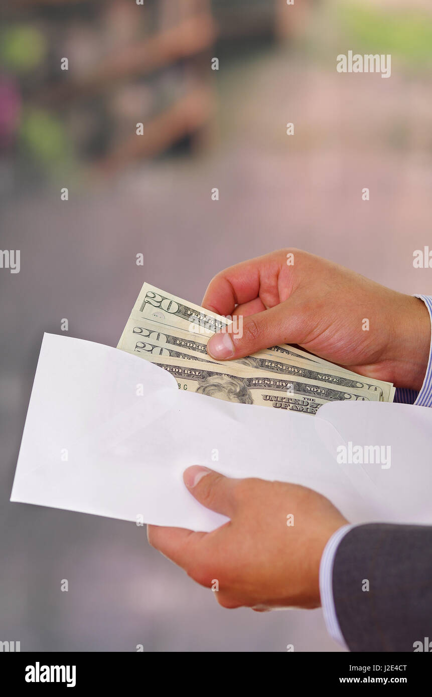 Some money inside of an envelope Stock Photo - Alamy