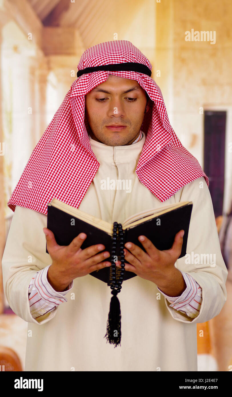 Adult Muslim Man Is Reading The Koran Stock Photo - Alamy