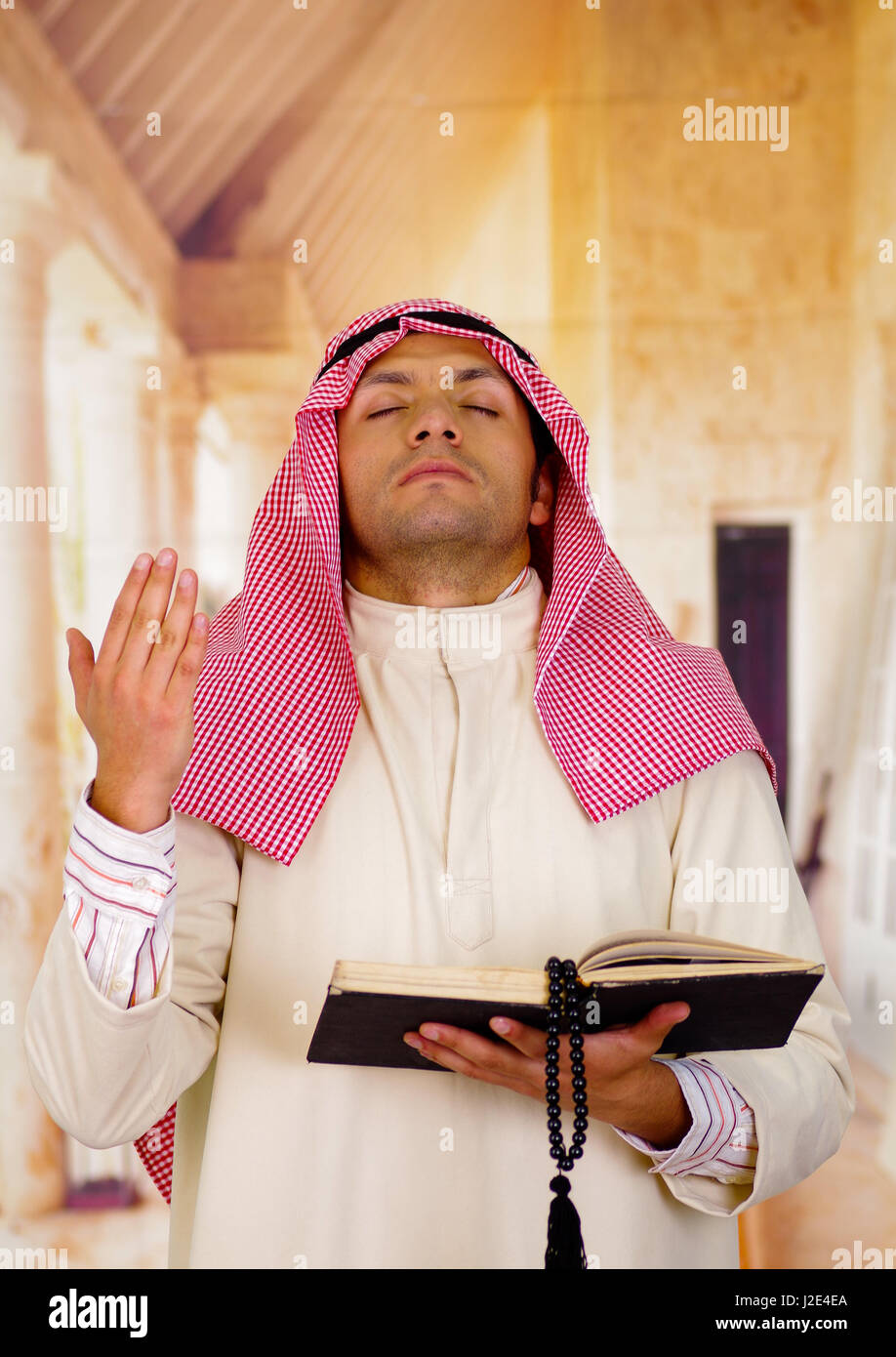 Adult Muslim Man Is Reading The Koran Stock Photo - Alamy