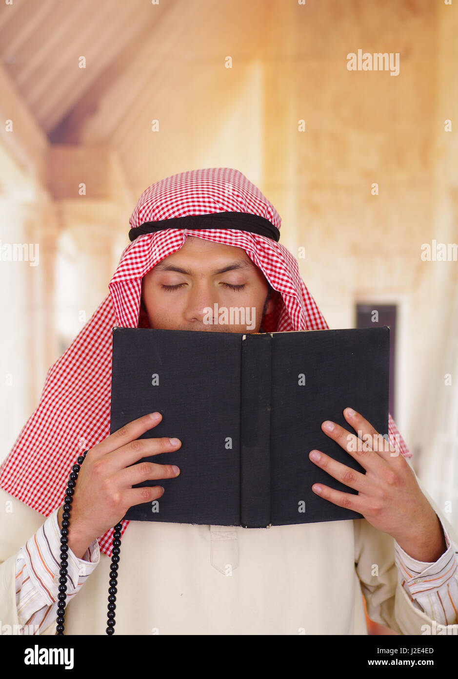 Adult Muslim Man Is Reading The Koran Stock Photo - Alamy