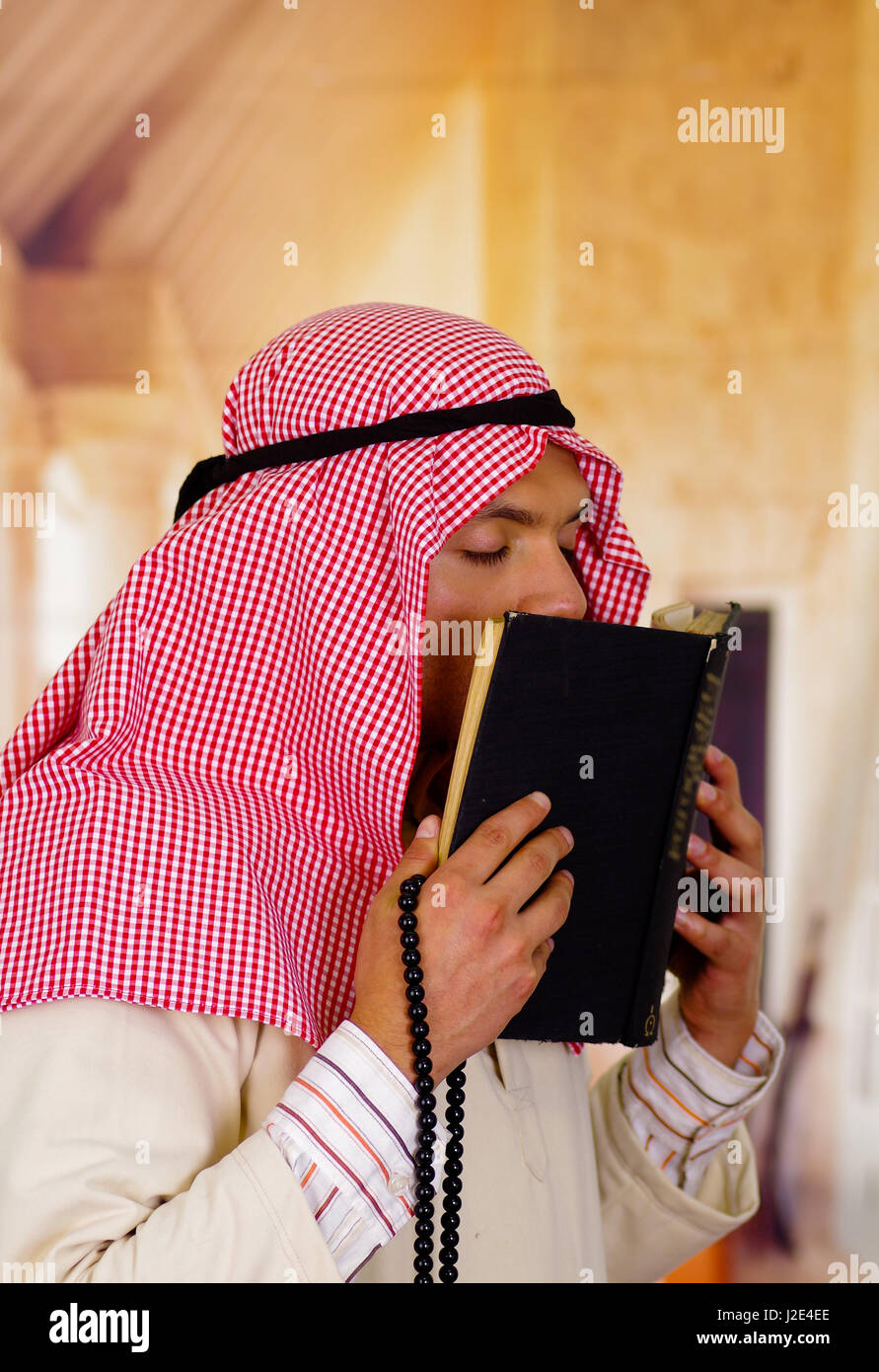 Adult Muslim Man Is Reading The Koran Stock Photo - Alamy