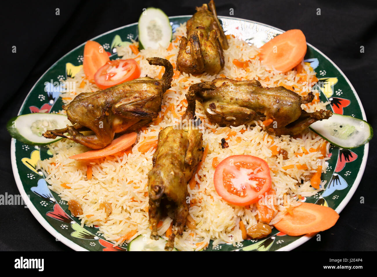 Fried Quail with Bukhara Rice Stock Photo - Alamy