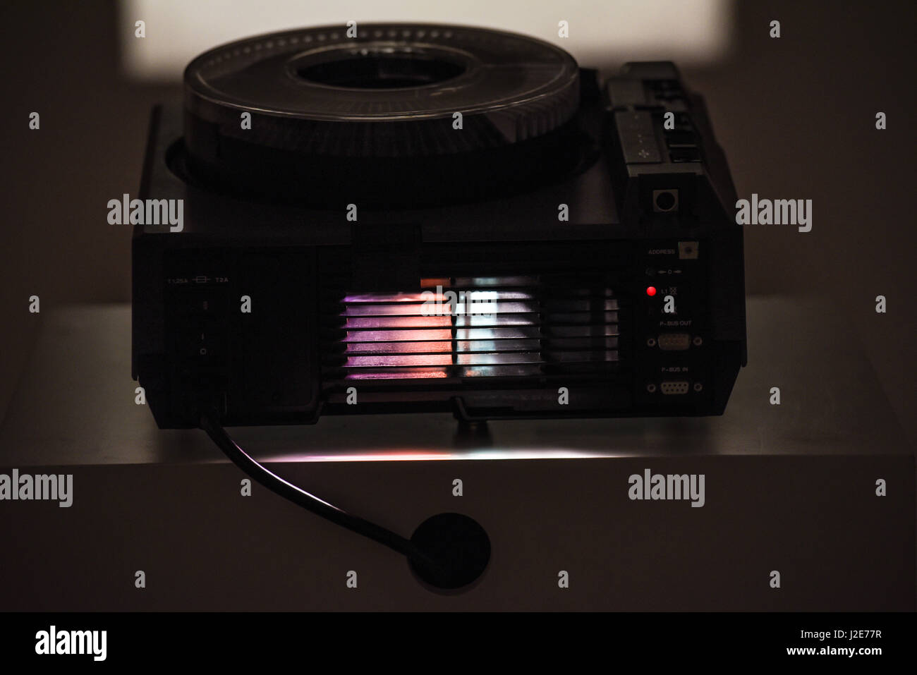 Old school projector with film showing movie Stock Photo - Alamy