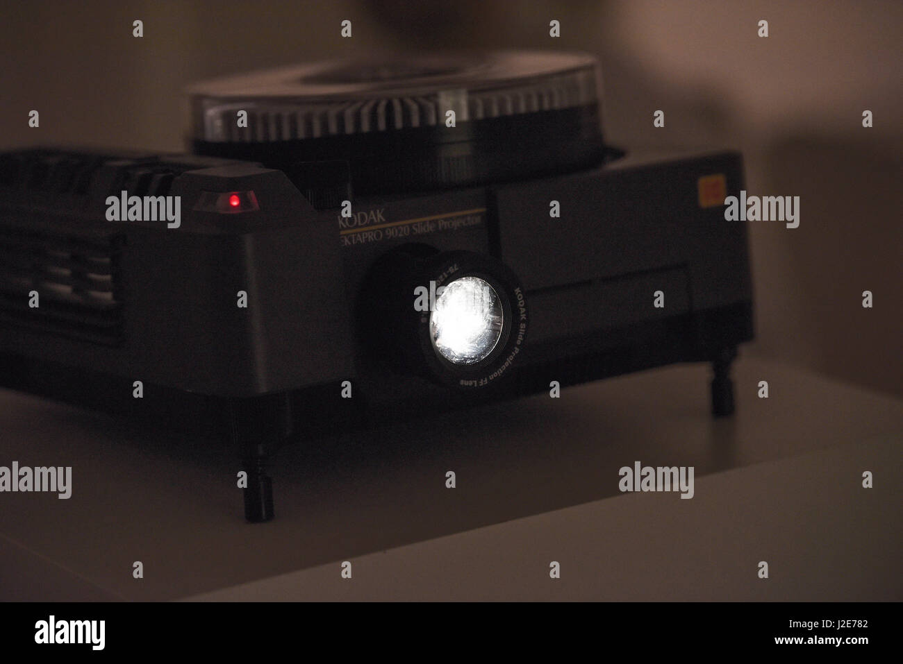 Old school projector with film showing movie Stock Photo - Alamy