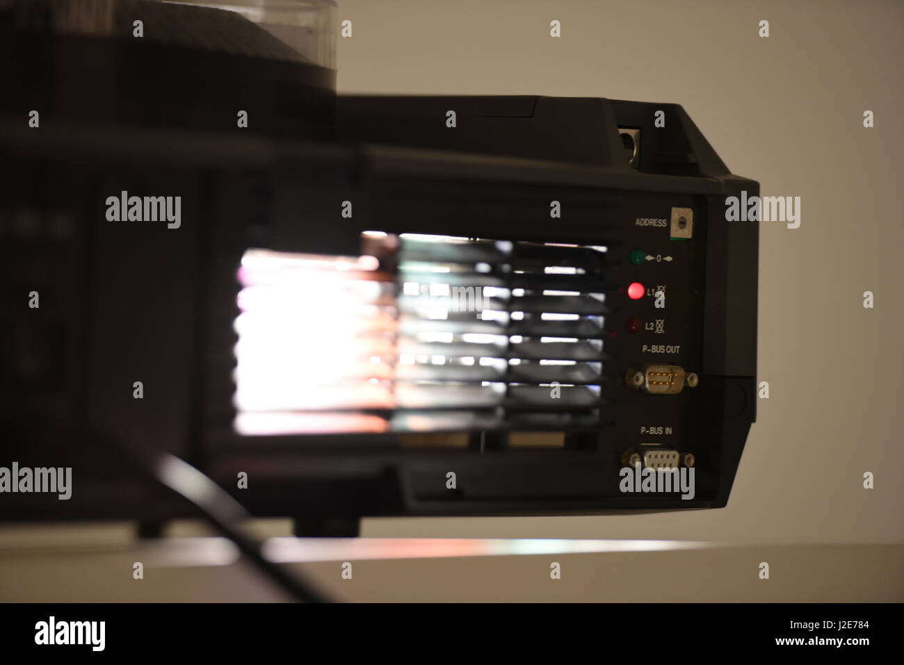 Old school projector with film showing movie Stock Photo - Alamy
