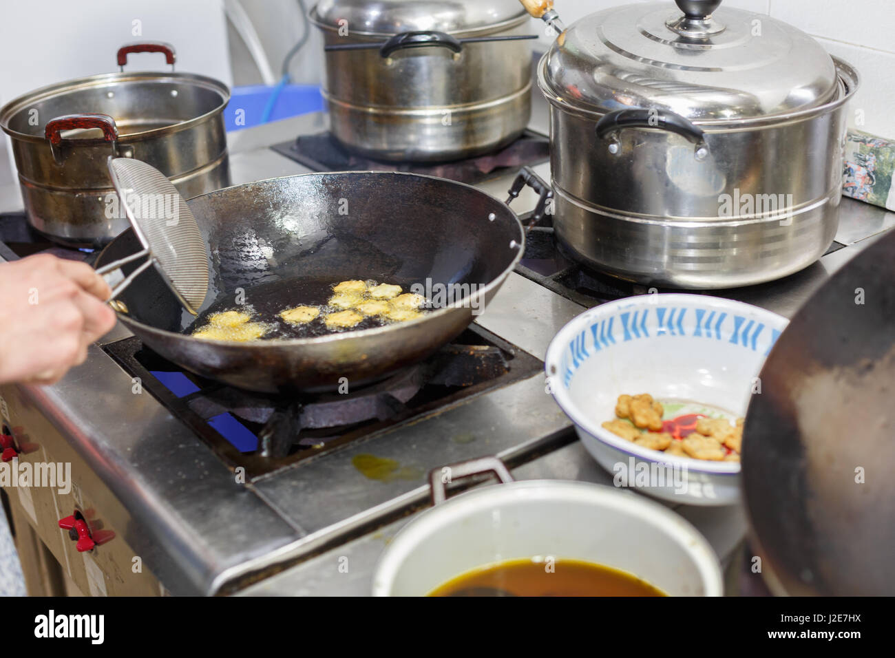 The scene of fried cooking food In the kitchen Stock Photo - Alamy