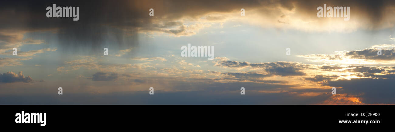 Evening sky with rain clouds panorama view. Seven shots composite ...