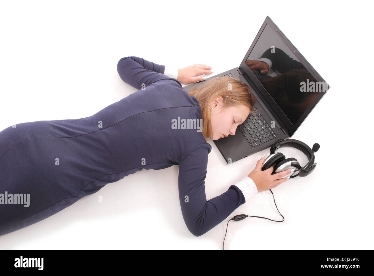Image of cute young sleeping girl lies near laptop computer in ...