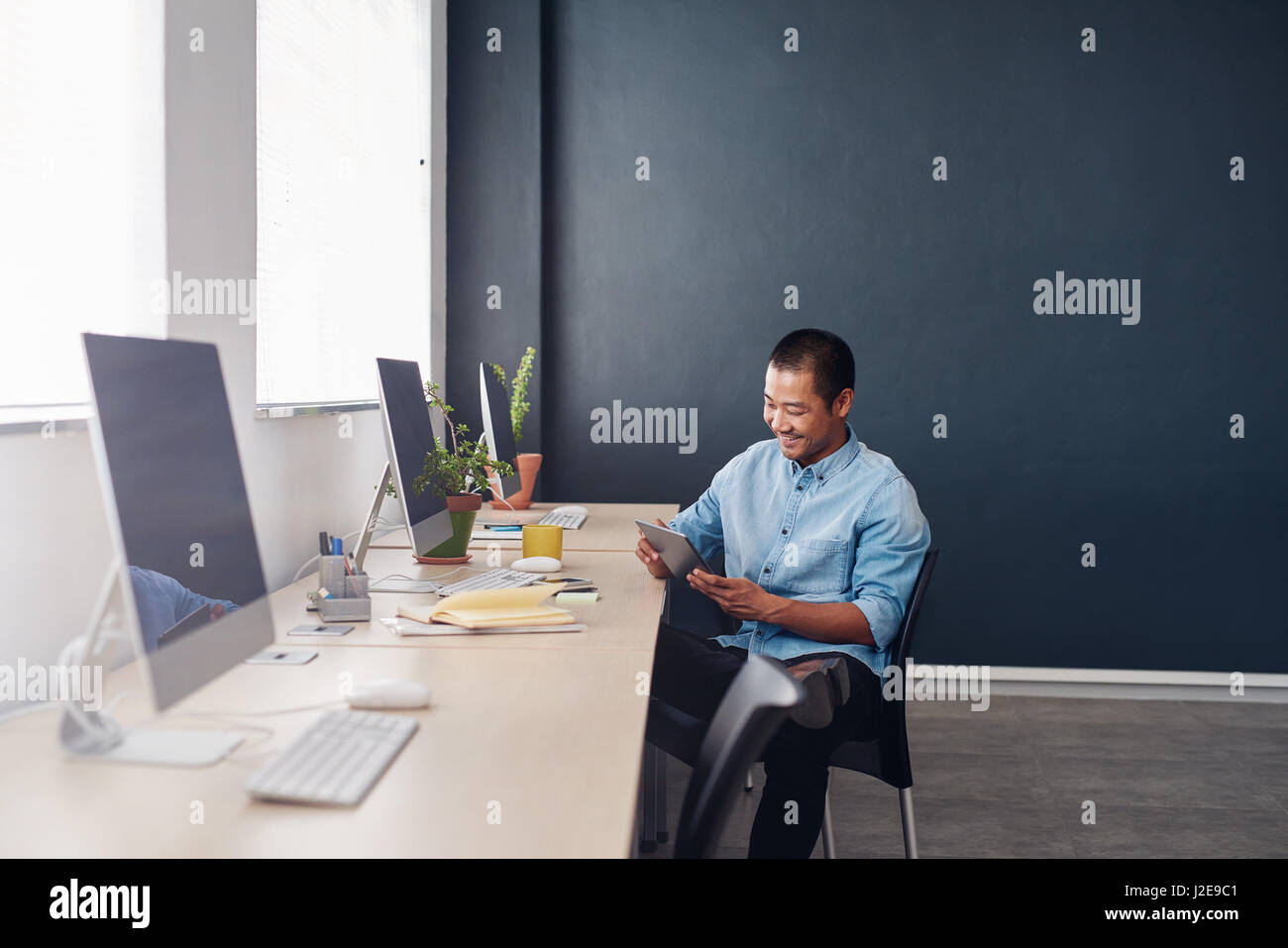 Asian business man work tablet hi-res stock photography and images - Alamy