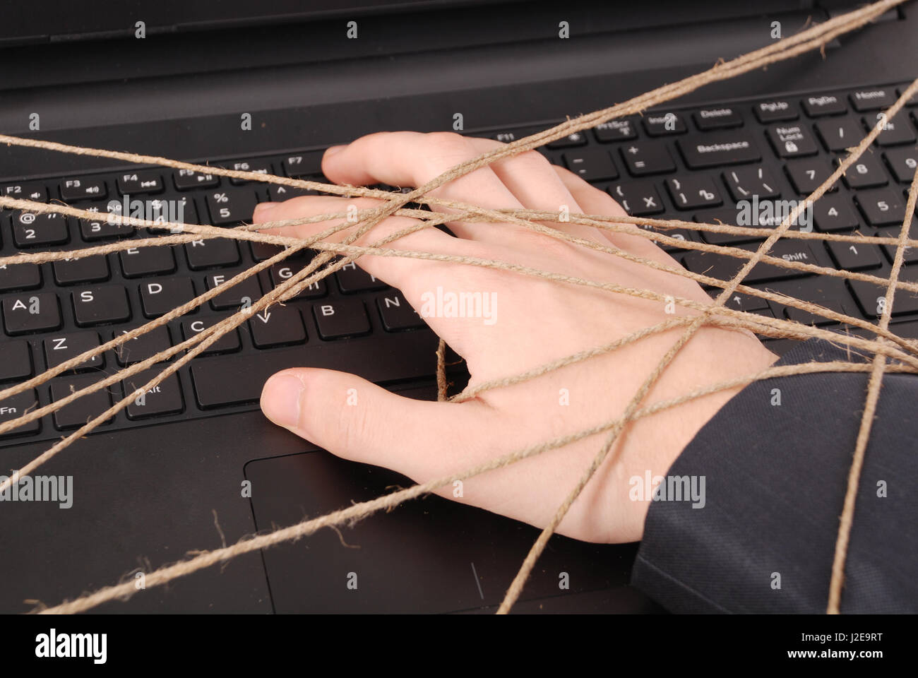 Hand thread associated with the laptop. Close-up Stock Photo - Alamy