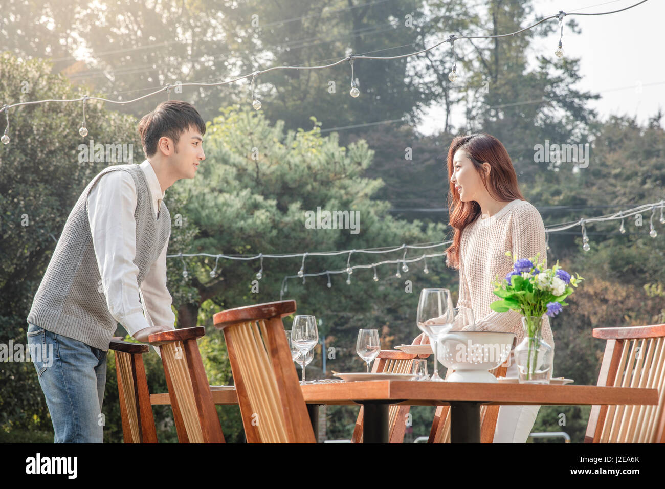 People setting hi-res stock photography and images - Alamy