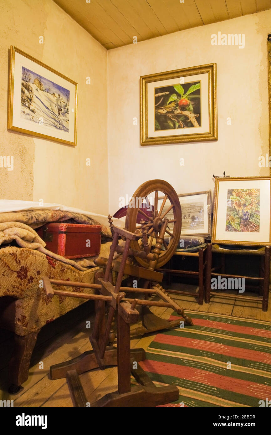 Spinning wheel and picture frames in parlour room on upstairs floor ...