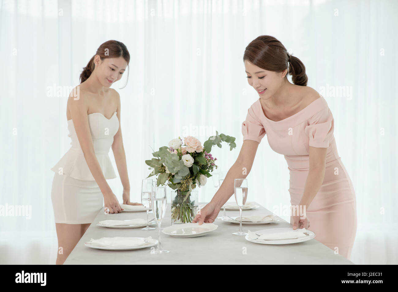 Two young smiling women at party Stock Photo - Alamy