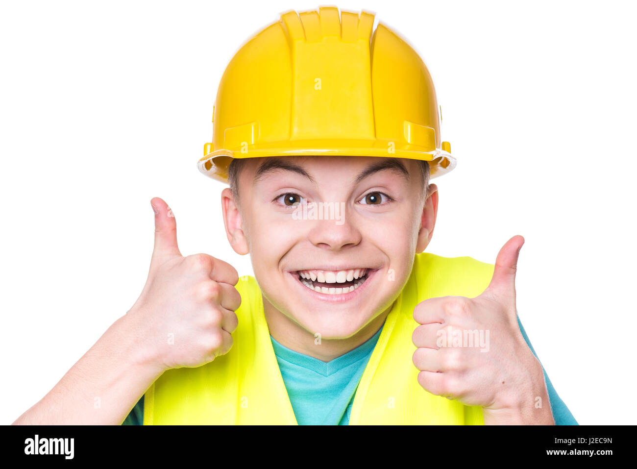 Boy wearing yellow hard hat Stock Photo - Alamy