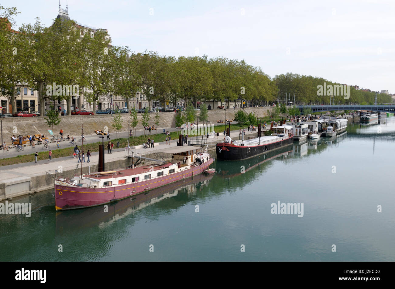 France, Rhone-Alpes, Lyon. Barges tied up on the banks of the Rhone ...