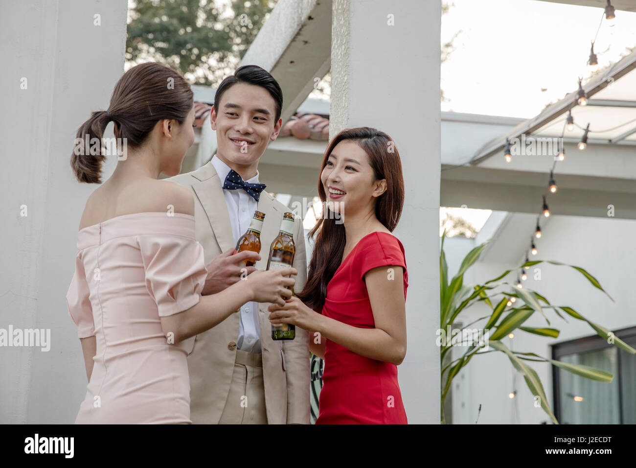 Two women man smiling hi-res stock photography and images - Alamy