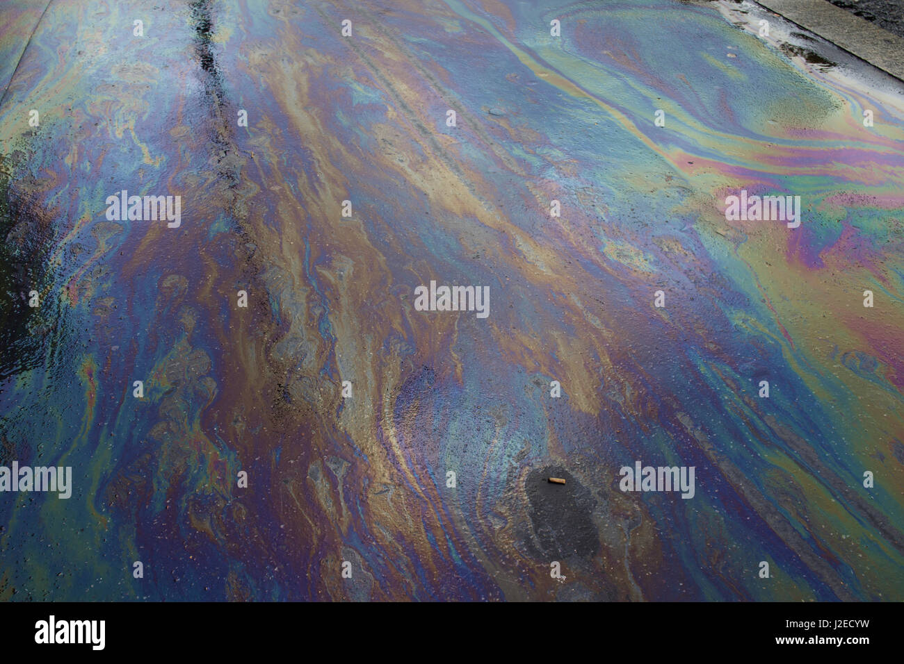 Paris, France, oil has been poured on a wet pavement Stock Photo - Alamy