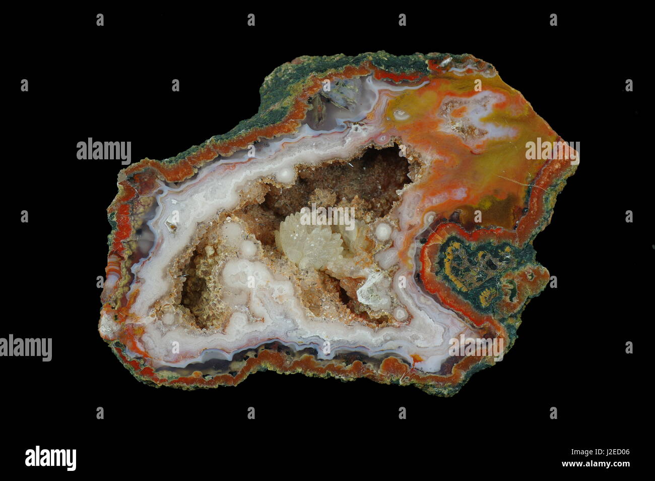 A cross section of the agate stone. Inside geode is a "calcite brush ...