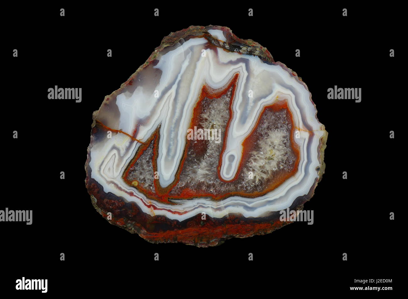 A cross section of the stalactite agate stone with quartz geode. Silica ...