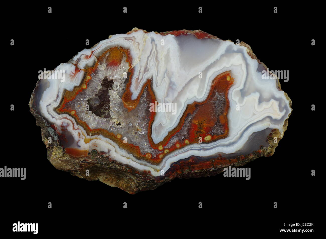 A cross section of the stalactite agate stone with quartz geode. Silica ...