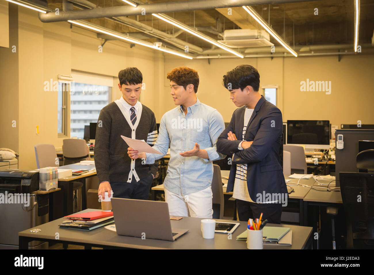 Three businessmen at work Stock Photo - Alamy
