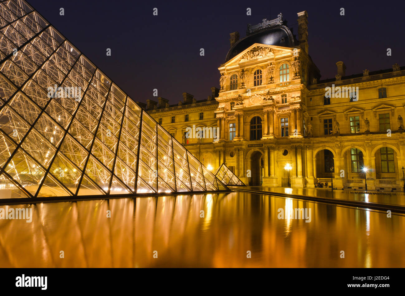 Louvre Palace and Pyramid at night, Louvre Museum, Paris, France Stock ...