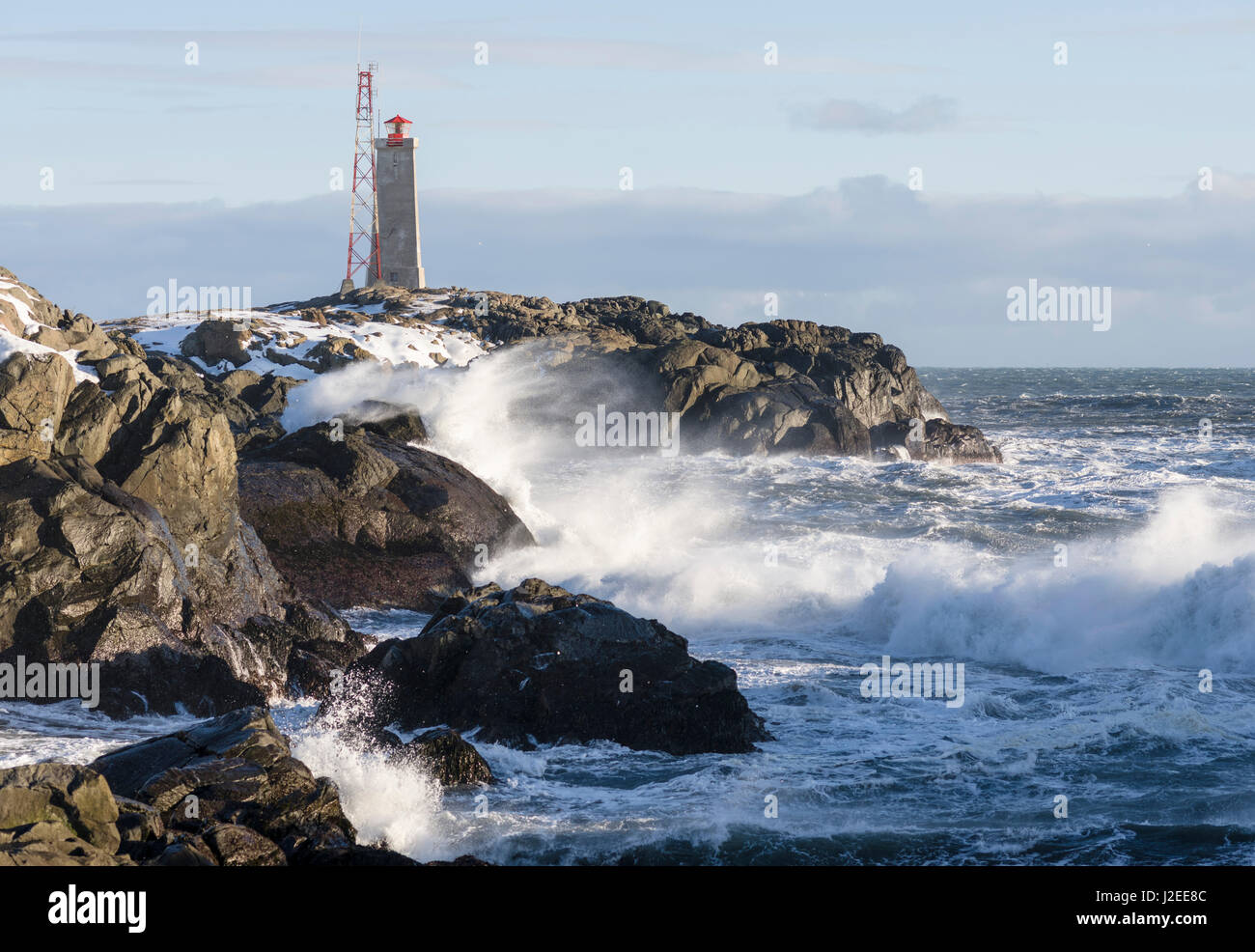 The Lighthouse at cape Stokksnes during winter on a stormy and sunny ...