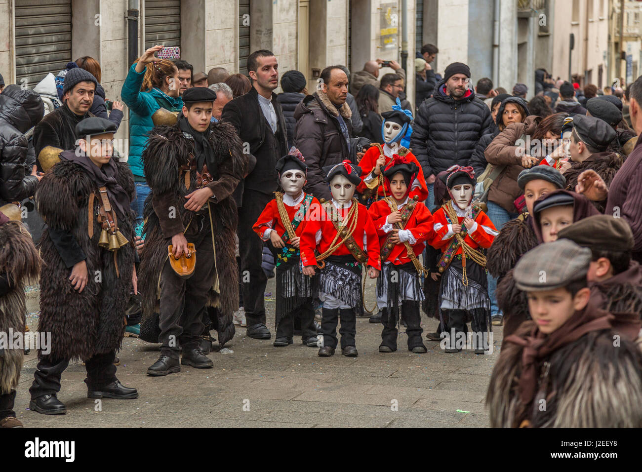 Italy, Sardinia, Mamoiada. Young boys dressed as Issohadores and ...