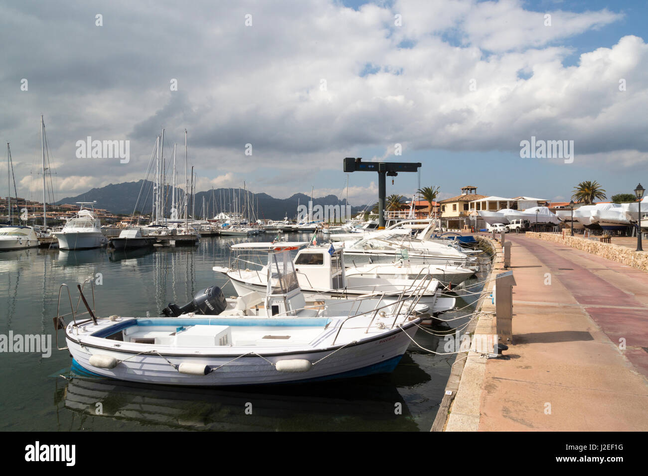 Italy, Sardinia, Costa Smeralda. Boat dock along the Mediterranean ...