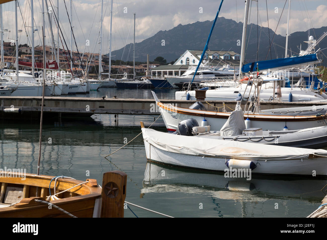 Italy, Sardinia, Costa Smeralda. Boat dock along the Mediterranean ...