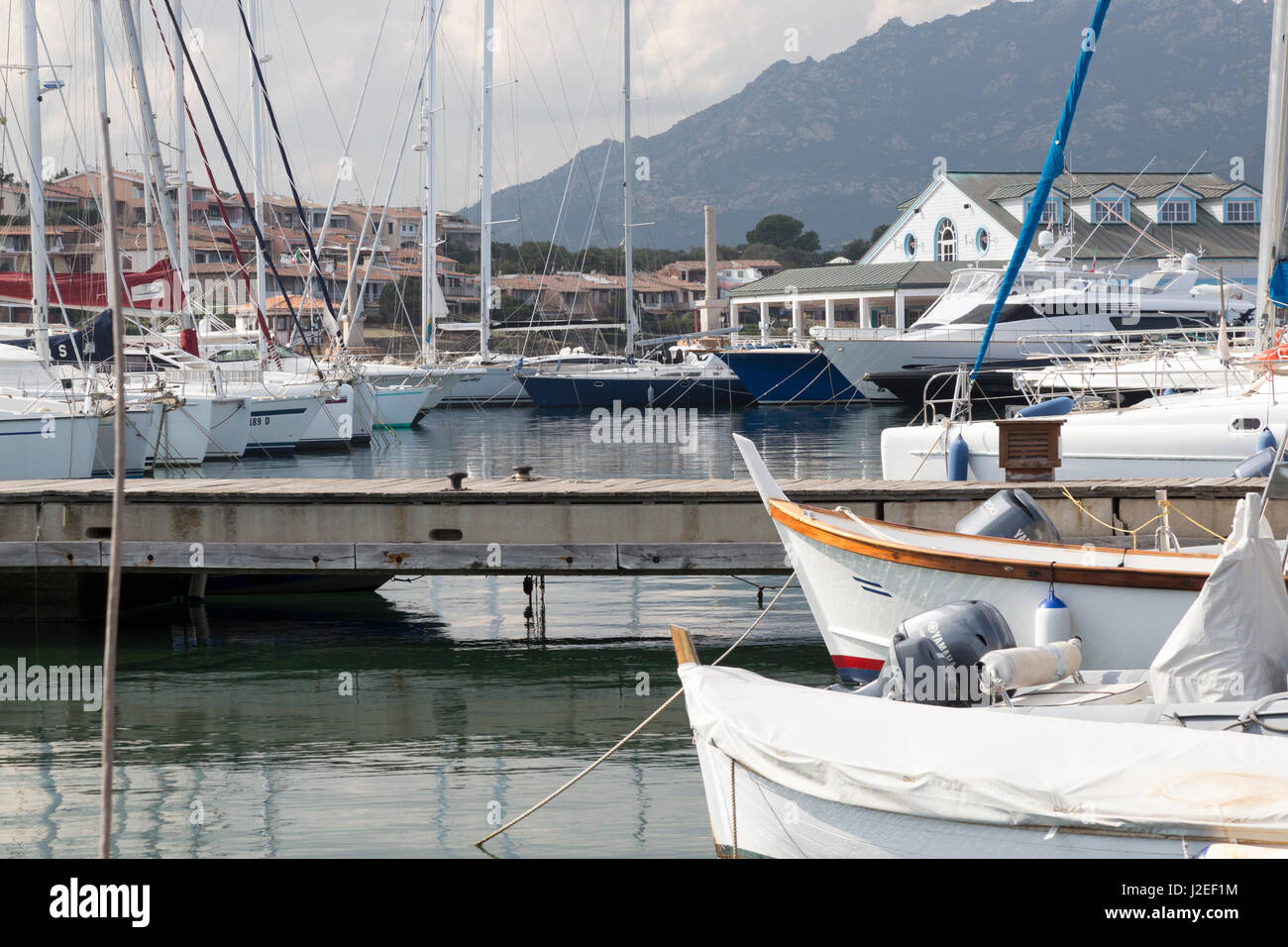 Italy, Sardinia, Costa Smeralda. Boat dock along the Mediterranean ...