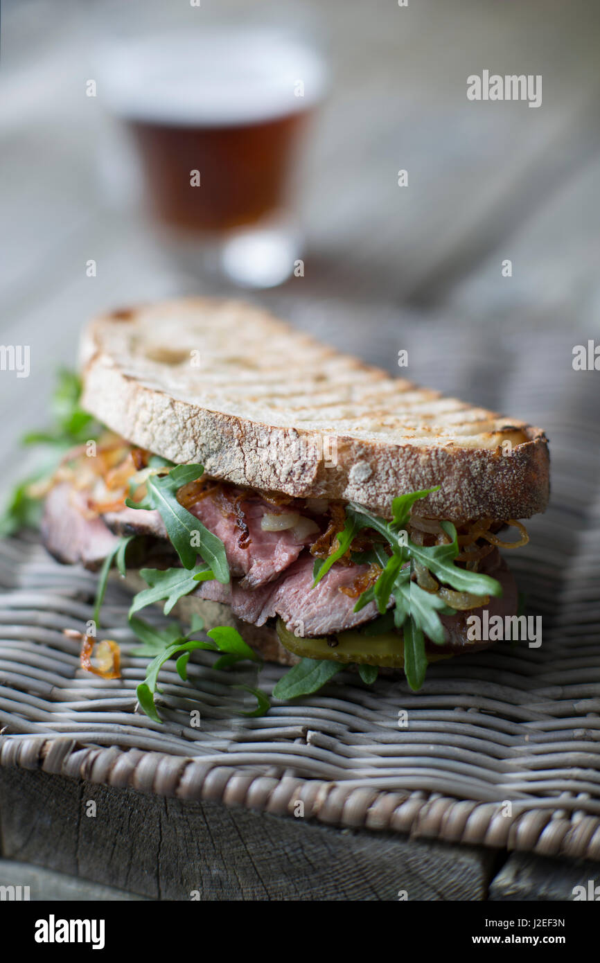 Toasted beef and rocket sandwich with crispy onion slices Stock Photo ...
